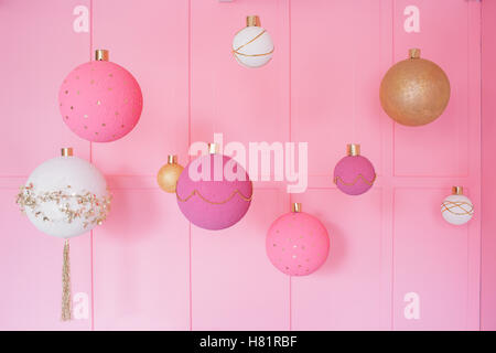 Large Christmas balls on a pink background in children room Stock Photo ...