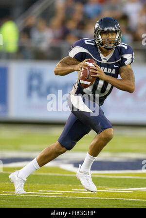 Nevada quarterback Colin Kaepernick (10) leap across the goal line to ...