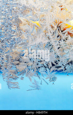 Beautiful ice pattern and sunlight closeup on window glass early in the ...