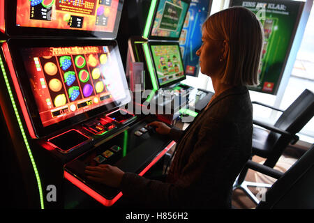 ILLUSTRATION. A woman uses a gambling machine during a demonstration of ...