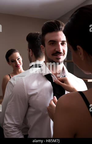 Young man preparing to go out Stock Photo - Alamy