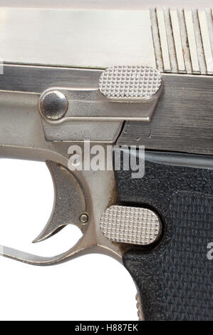 Semi-automatic pistol with its takedown lever rotated to remove the ...