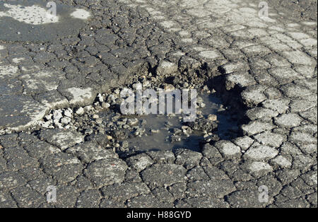 Large pit on the old road Stock Photo - Alamy