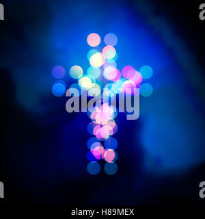 Bright Christian cross symbol with blue sky background. Crucifixion ...