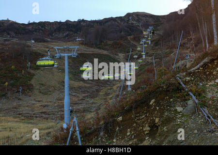 Mountain zipline through autumn forest on backdrop of Caucasus Stock ...