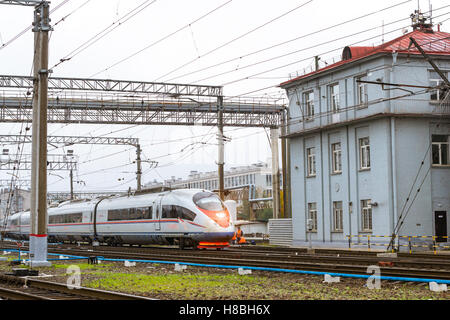 Modern hybrid electric locomotive Sapsan pulling a high-speed train ...