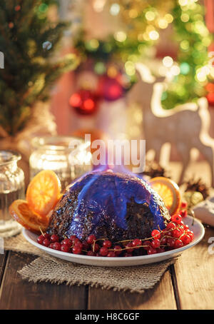 Traditional Christmas cake pudding with fruits and nuts with Christmas ...