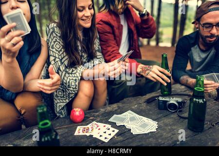 Friends Camping Playing Cards Concept Stock Photo - Alamy