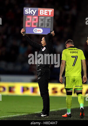 The fourth official holds up an electronic board signalling five ...
