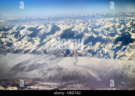 Flight over Pamir and Tien Shan 1. Air travel. Visible deep mountain ...