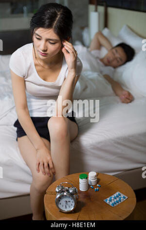 Asian young women suffering headache tired exhausted stress holding ...