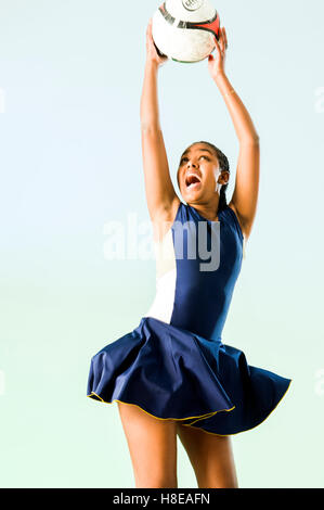 Young African woman with netball Stock Photo - Alamy