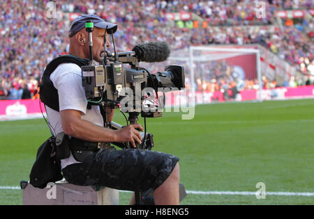 Television Cameraman filming a Football match. Picture by James Stock ...