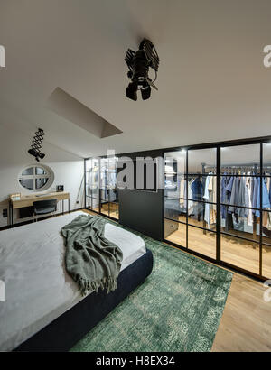 Interior of bedroom with modern furniture and glowing lamps at night ...
