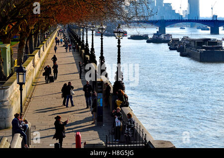 People seen walking at river Thames boulevard in Southbank district ...