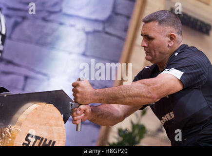 Jason Wynyard from New Zealand holds up his winner's trophy at the ...