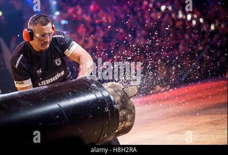 Jason Wynyard from New Zealand holds up his winner's trophy at the ...