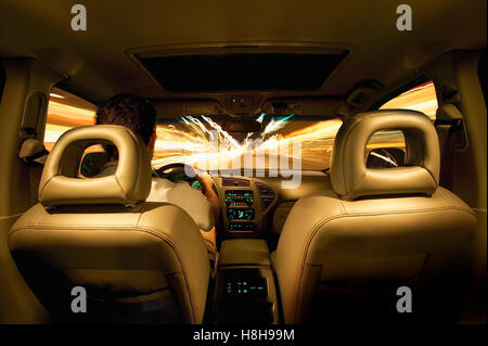 Driver's seat perspective inside vehicle driving on an extended bridge ...