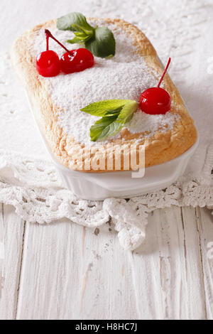 Tasty Austrian dessert souffle Salzburger Nockerln with cherries and ...