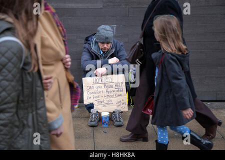 cardboard sign of a job-seeking homeless person with the inscription ...