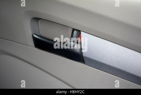 Car door handle inside, closeup view. Interior of modern car with door ...
