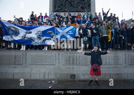 Scotland fans wearing kilts in joyous mood drinking and singing ...