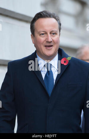 David Cameron walks through Downing Street to attend the Remembrance ...