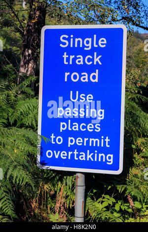 Single track road with passing places road sign Stock Photo - Alamy