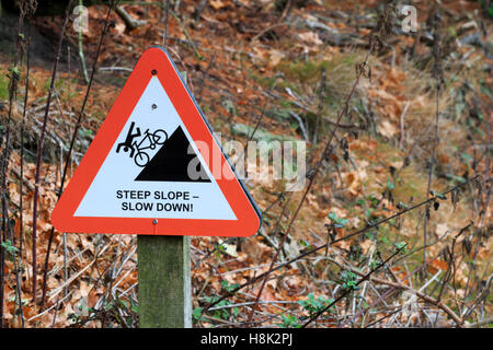 Cyclist steep slope slow down triangle warning sign Stock Photo - Alamy