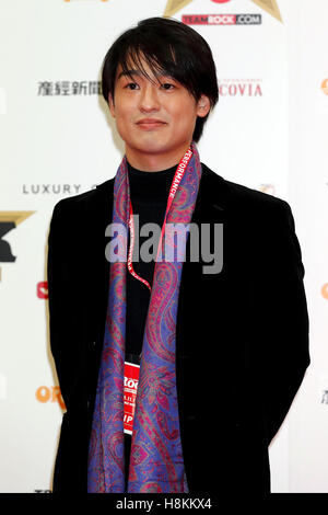 Actor Yuya Ozeki poses for the cameras during the red carpet for the ...