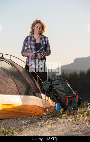 Beautiful woman backpacking in wilderness Stock Photo - Alamy