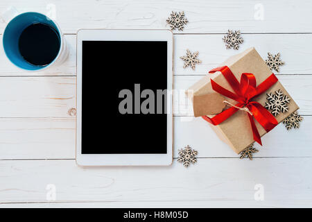 Christmas gift box on tablet Stock Photo - Alamy