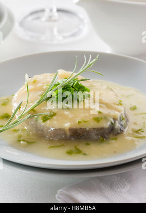 Fried hake fish fillet in a frying pan at kitchen Stock Photo - Alamy