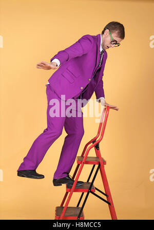 Man falling off the ladder. Accident of a man worker at the ...