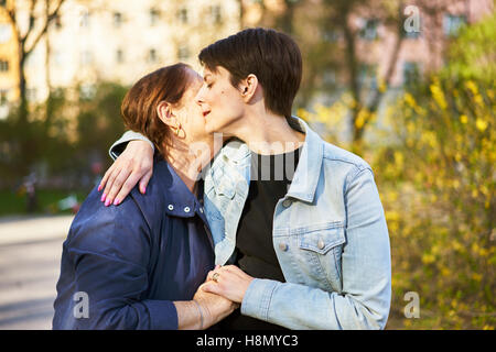 Two women embracing Stock Photo - Alamy