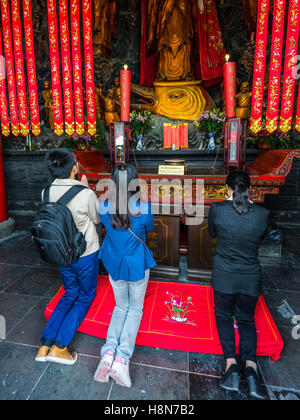 Chinese Prayer praying at Temple in Hong Kong Stock Photo: 118929487 ...