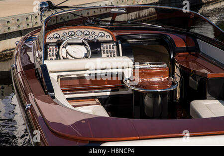 Classic wooden power boat Riva Tritone passing Poncelet with high speed ...