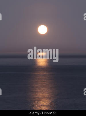 Super moon sets over the Pacific ocean in Laguna Beach, California ...