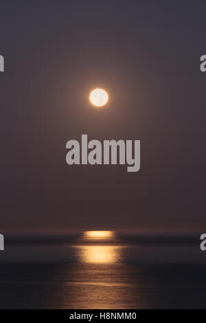 Super moon sets over the Pacific ocean in Laguna Beach, California ...