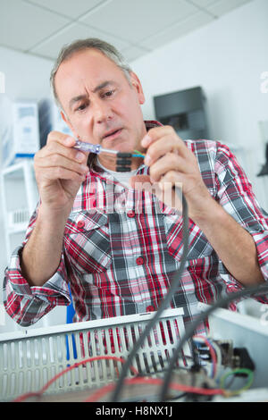 Technician reparing a broken computer. Computer service and repair ...
