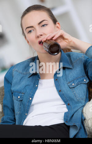 Alcohol addiction. Miserable woman with whiskey at table in dark Stock ...