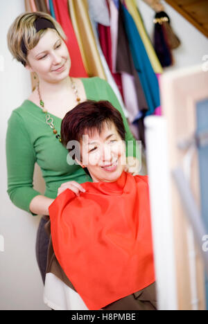 Hairdresser Advising Hair Color To Customer Stock Photo - Alamy