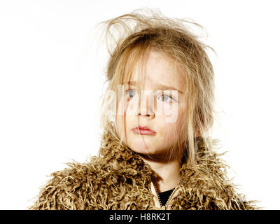 Disheveled preschooler girl with stupid face, isolated on white ...