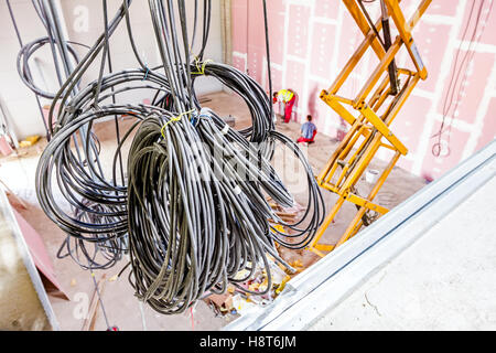 Installation of various cables in a building site, power lines and ...