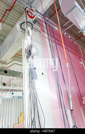 Installation of various cables in a building site, power lines and ...
