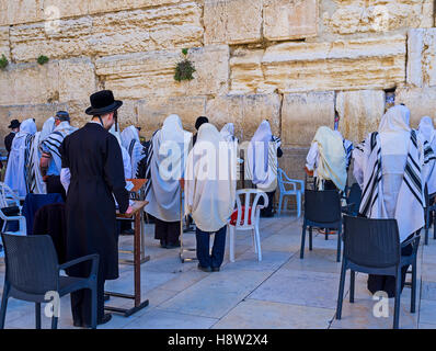 Jews in traditional clothes pray at the Wilson's Arch at the Wailing ...