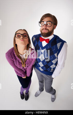 A high-angle shot of a couple next to a flower store in Porto Portugal ...