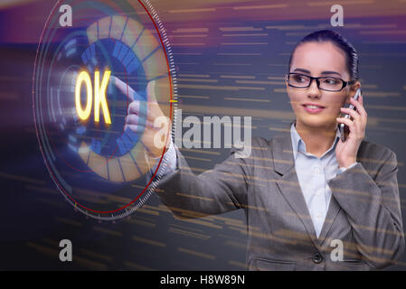Businesswoman pressing virtual button OK Stock Photo - Alamy