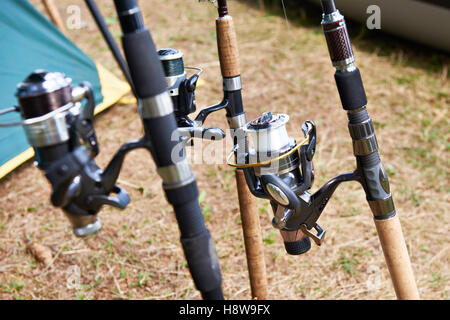 Still life with fishing rods and hiking tent Stock Photo - Alamy