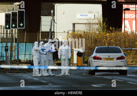 Police forensic officers at the scene where a man died after being shot ...